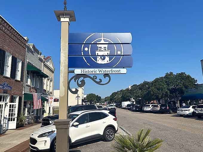 The Historic Waterfront sign beckons visitors toward Georgetown's maritime heritage, where coastal breezes meet charming downtown streets lined with character.