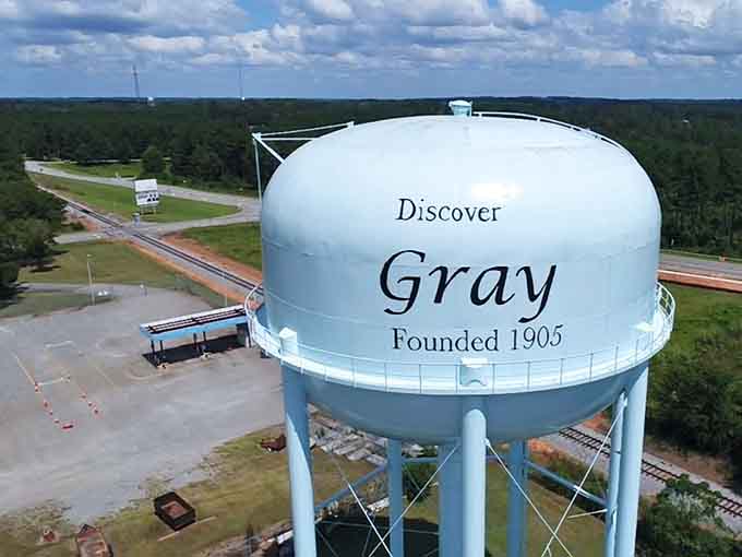 The water tower proclaims "Discover Gray" like a friendly billboard inviting you to slow down and stay.