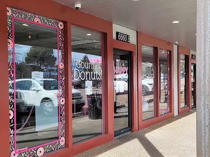 The decorative window frames add a touch of whimsy that hints at the gourmet creations waiting inside for you.