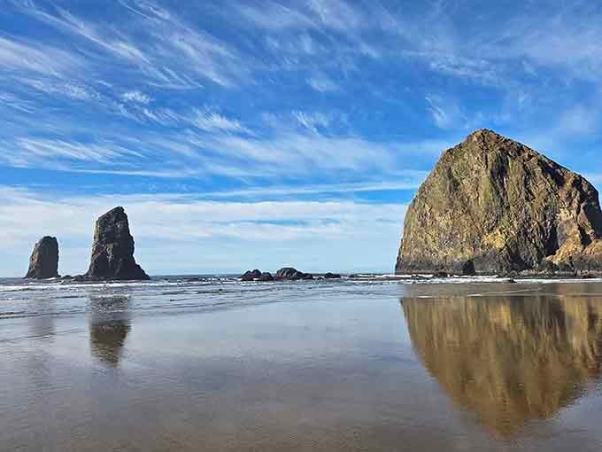 Those wispy clouds above Haystack Rock look like nature hired a professional set designer for the day.