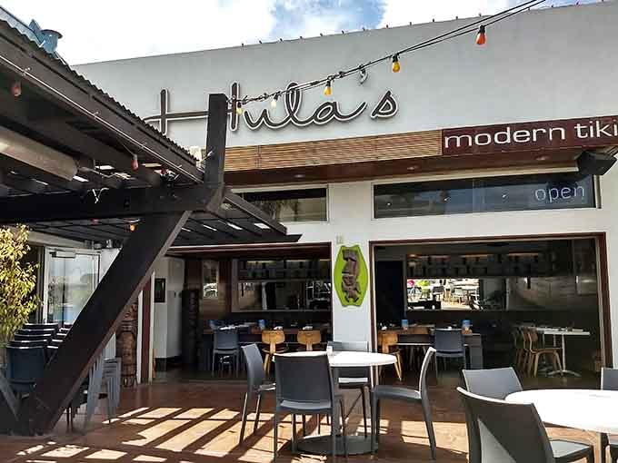 String lights and modern design blend tropical vibes with contemporary style under the desert sun's warm glow.