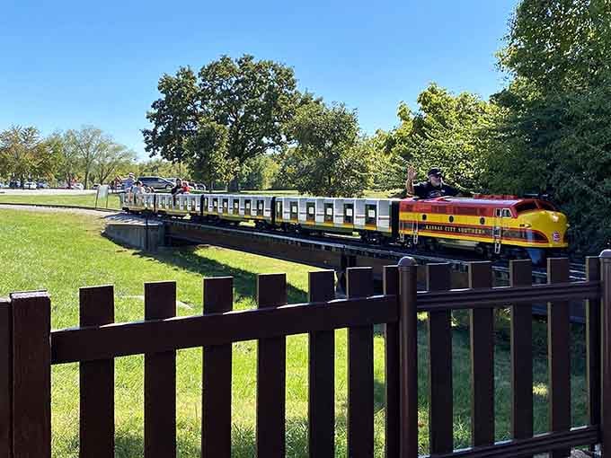 That golden locomotive gleaming under blue skies proves miniature trains can deliver maximum joy for all ages.
