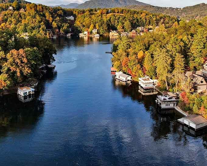 Fall foliage explodes around this pristine lake where houseboats bob gently like floating vacation homes.