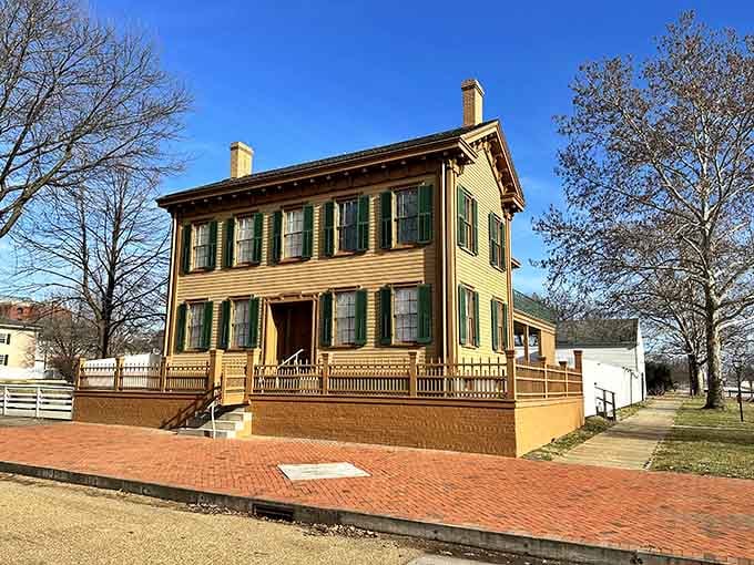 The Lincoln Home stands dignified with its green shutters and yellow trim, looking exactly as it did when history walked through that door.
