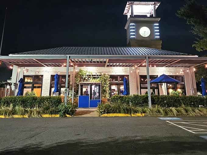 That charming clock tower standing tall at dusk reminds you that great meals are worth slowing down for.