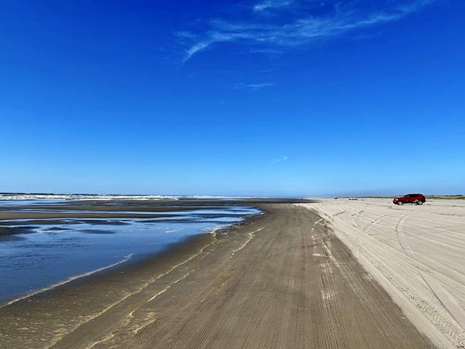 Miles of firm sand stretch ahead under endless blue skies: this beach highway welcomes cars and dreamers alike.