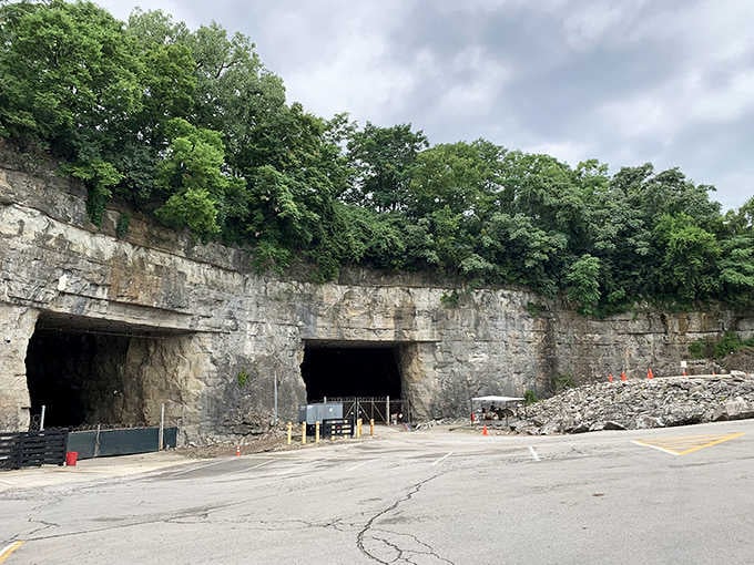Those massive limestone cavern entrances look like nature's own parking garage, carved from solid rock.