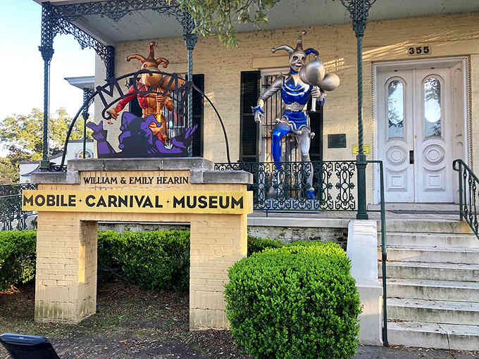 The colorful jester figures welcome you to Mobile's Carnival Museum, where Mardi Gras history comes alive year-round in this charming historic building.