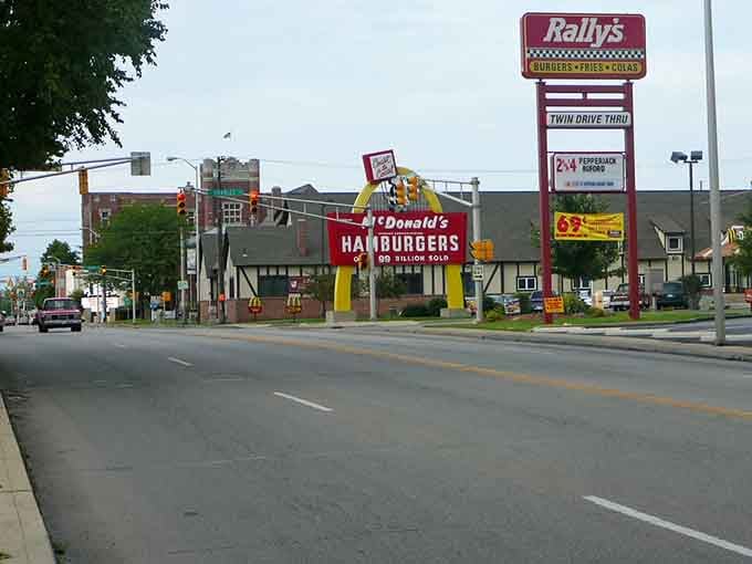 Golden arches meet Rally's in a delightfully retro roadside scene that'll make you nostalgic for simpler times.