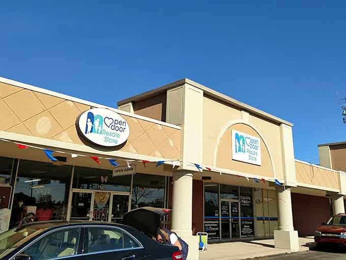 Cheerful bunting and sunny skies frame this welcoming entrance where community spirit meets smart shopping every single day.