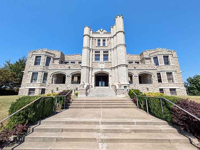 Grand limestone steps lead to castle-like towers, where history and architecture merge in unexpected Midwestern Gothic splendor.