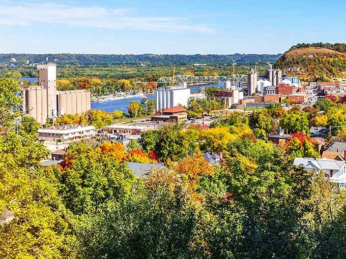 Autumn's paintbrush sweeps across the river valley, where historic grain elevators stand sentinel over this charming waterfront town.