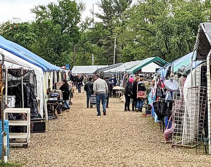 Rows of colorful canopies stretch ahead like a treasure map, each tent promising something wonderful you didn't know you needed.