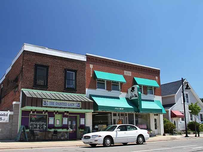 The Painted Lady storefront with its turquoise awning shows how local businesses add personality without pretension.