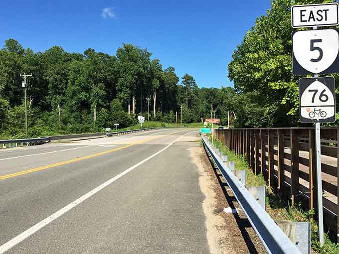Route 5 stretches ahead with bike-friendly shoulders, inviting cyclists to pedal through centuries of American stories.