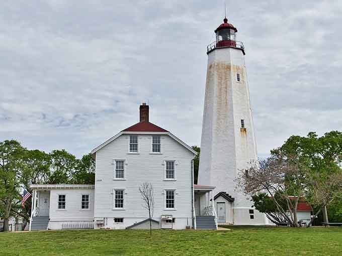 The weathered keeper's house sits peacefully beside its towering companion, telling stories of families who called this place home.