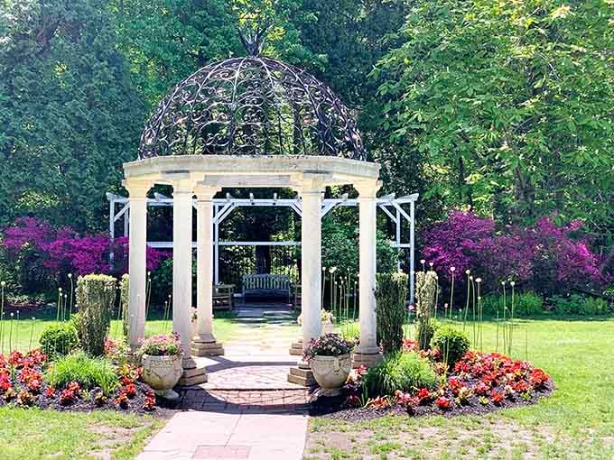 This elegant gazebo surrounded by vibrant blooms is where garden parties and marriage proposals come to life beautifully.