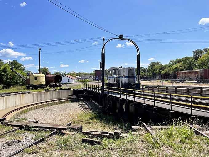 Vintage railroad equipment rests on weathered tracks, preserving the romance of steam-powered travel from bygone eras.