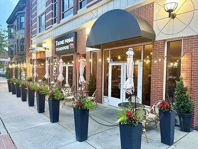 String lights and potted evergreens create an enchanting streetside setting that makes every meal feel like a celebration.