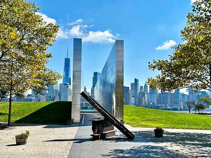 Two gleaming steel walls frame the skyline where the Twin Towers once stood, creating a powerful window to memory.
