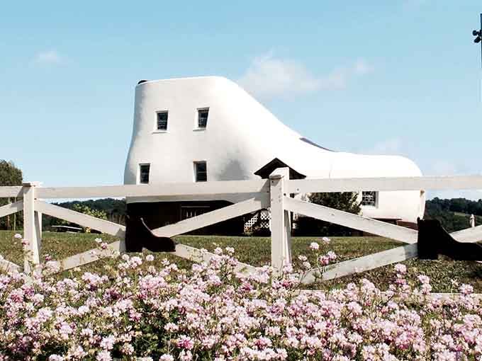 A giant white boot sitting in a field surrounded by flowers is wonderfully, delightfully absurd.