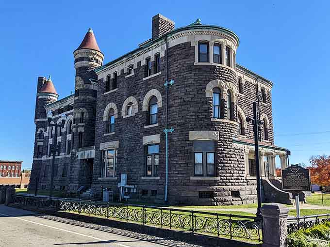 Dark stone and corner turrets make this historic jail look like it could hold Rapunzel or hardened criminals equally well.