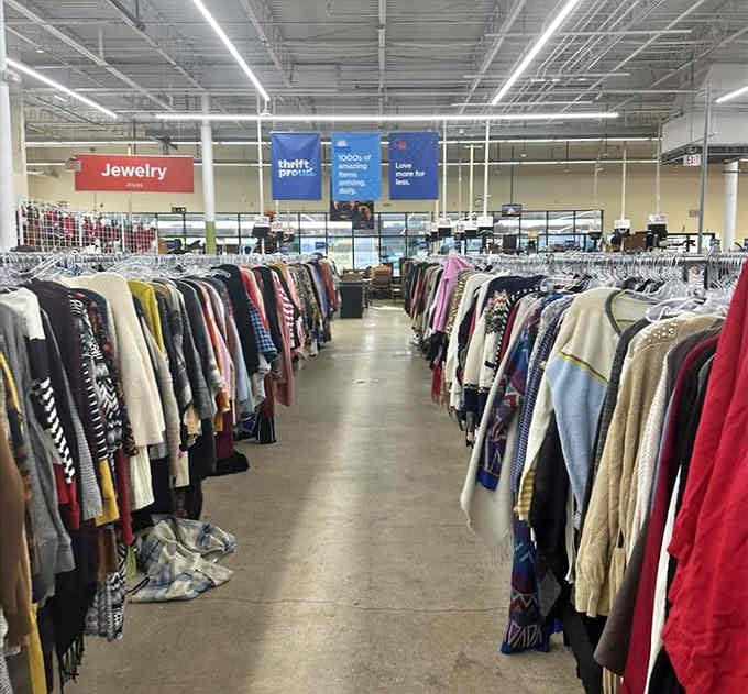 Endless racks of colorful clothing stretch toward the horizon like a rainbow made entirely of second chances.