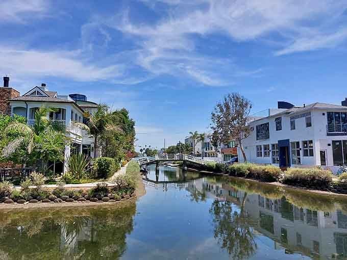 Arched bridges span peaceful canals where palm trees sway&mdash;Venice meets Los Angeles in the most delightful neighborhood surprise.