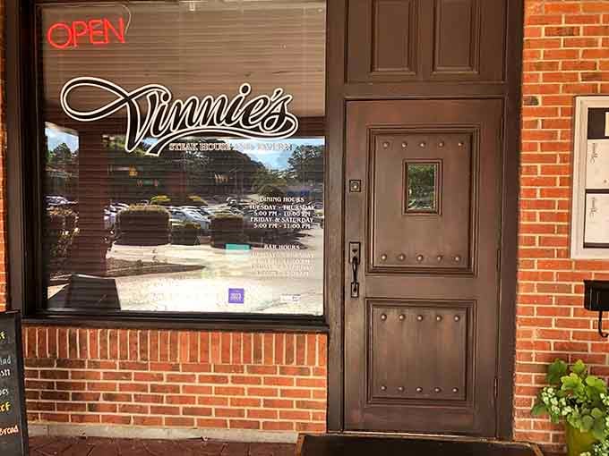 That elegant script glowing in the window promises old-school steakhouse charm where quality trumps flashy gimmicks every single time.