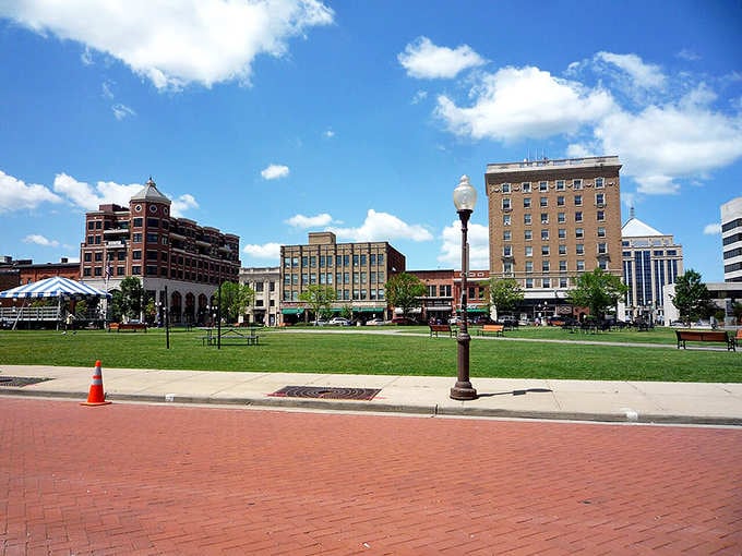 Open green spaces and historic architecture create an inviting downtown plaza perfect for community gatherings and peaceful afternoons.