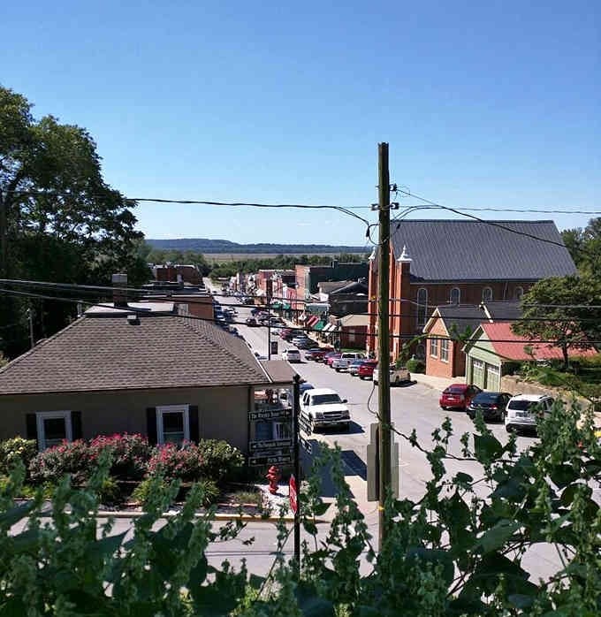 Looking down Main Street reveals historic buildings framed by rolling hills that seem to go on forever.