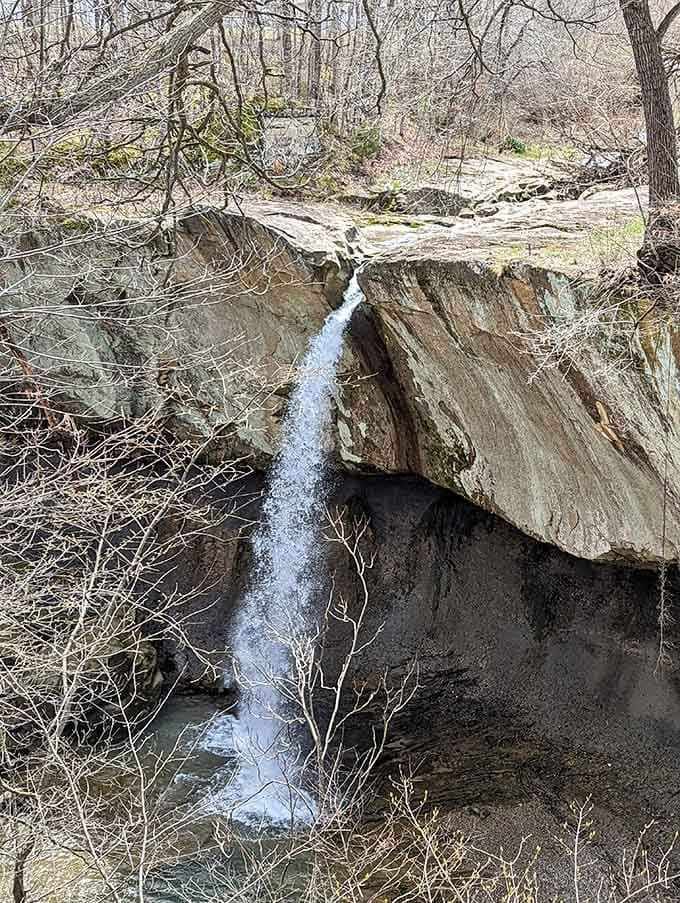 Water tumbles through carved limestone into a hidden grotto, creating its own peaceful soundtrack for contemplative moments.