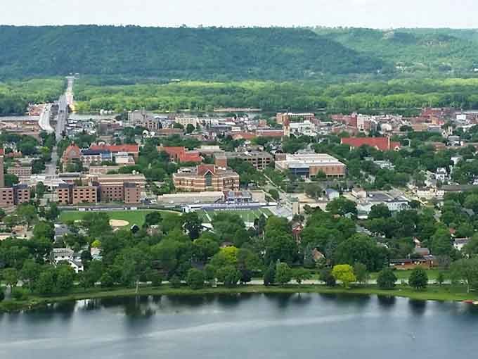 Lush summer greenery frames a community where neighborhoods blend seamlessly with natural beauty and working industry.