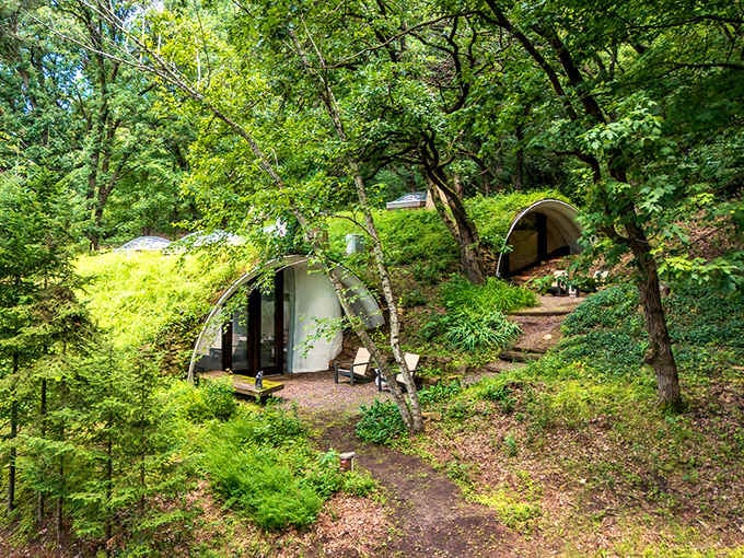 Round doors nestled into grassy hillsides make Middle-earth fantasies come alive in the Wisconsin countryside beautifully.
