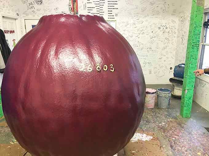 This burgundy sphere has grown layer by layer, becoming a testament to patience and wonderfully quirky dedication.