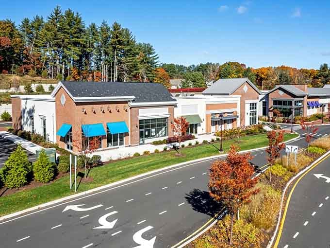 Modern shopping meets New England autumn as fall foliage frames this thoughtfully designed retail center perfectly.