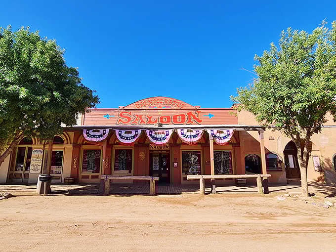 The patriotic bunting and wooden benches outside this historic saloon practically beg you to sit and stay awhile.