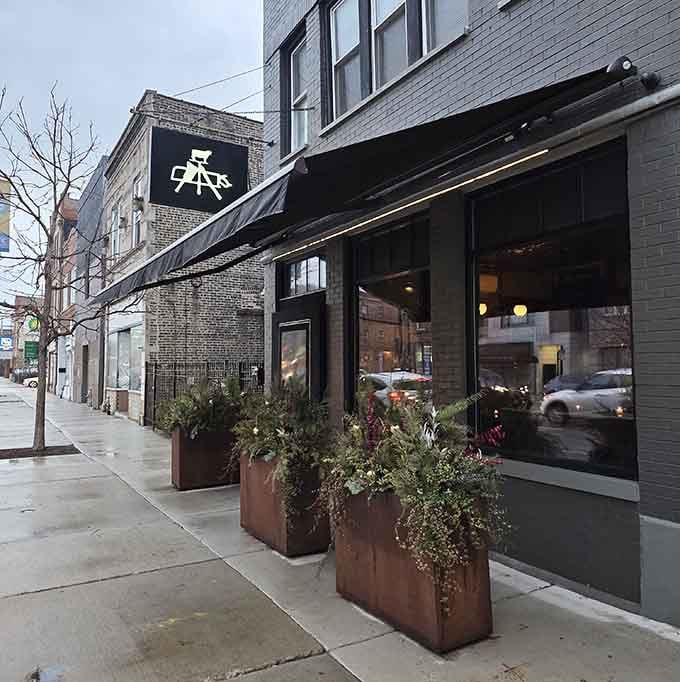 Those planters add a touch of green to the city streetscape, softening the modern edges of this neighborhood gem.