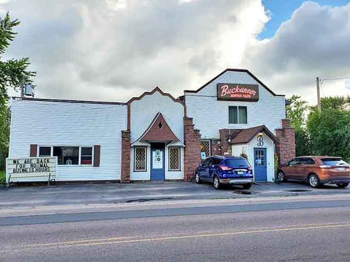 The charming hodgepodge of brick and siding creates an inviting entrance where hanging baskets welcome steak-seeking adventurers.