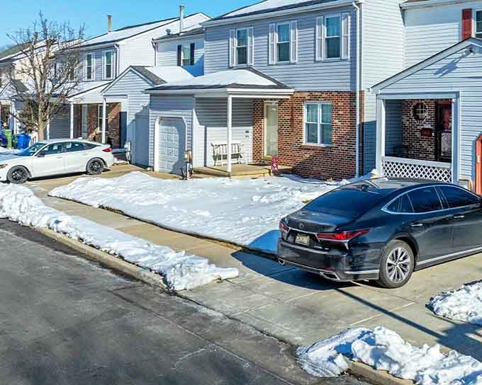 Brick facades and tidy driveways showcase communities where pride of ownership still means something real and tangible.