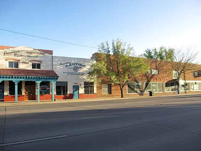 That Mexican restaurant's turquoise trim pops against morning shadows, promising flavors as authentic as the friendly service.