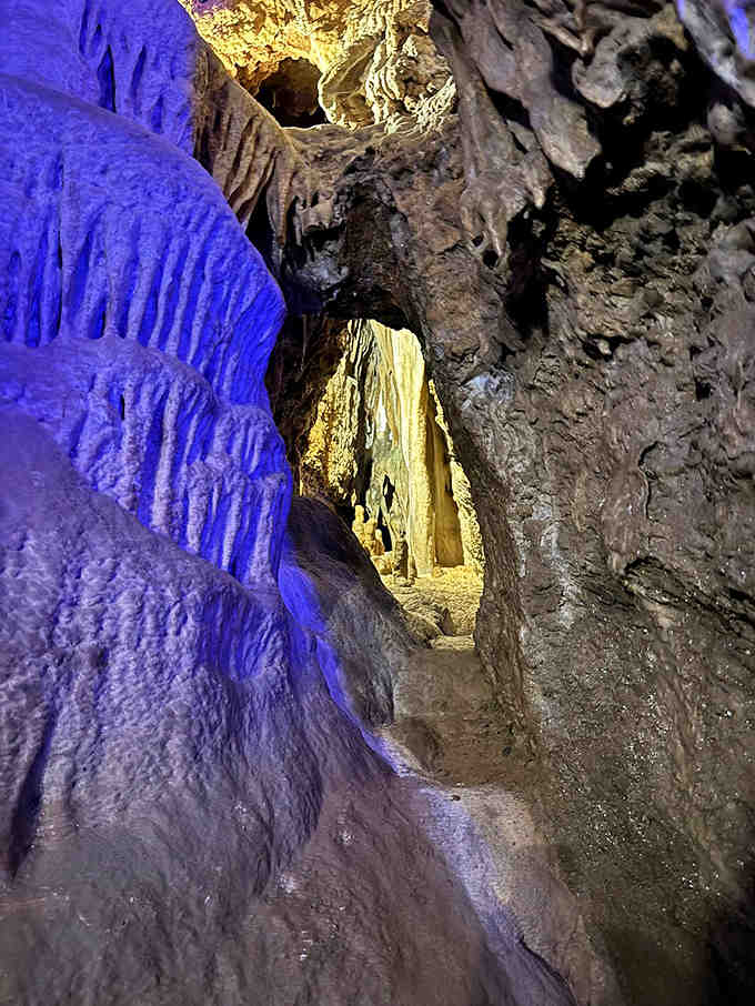 Electric blue and golden lighting transform ancient rock formations into an alien landscape worthy of Star Trek.