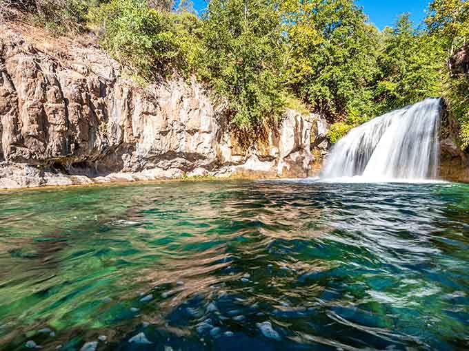 Crystal-clear water tumbles over travertine formations into a pool so inviting you'll want to dive right in today.