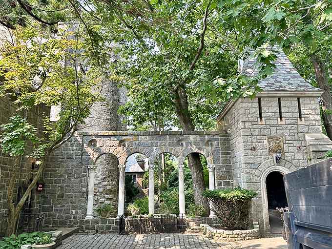 Arched stone passages and courtyard walls whisper tales of old-world craftsmanship nestled beside the Atlantic Ocean.