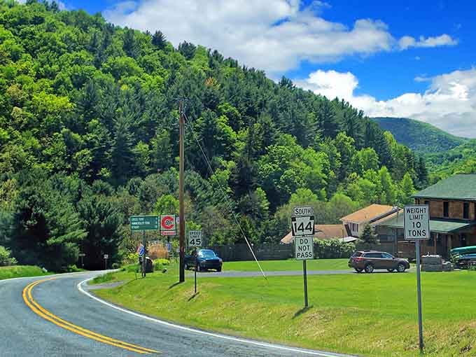Where Route 144 winds through green valleys, small-town charm meets mountain majesty in perfect harmony.