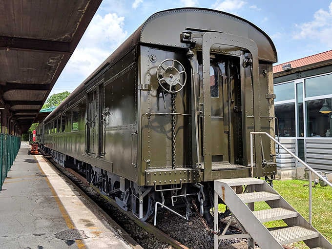 This vintage passenger car's riveted steel exterior and platform steps invite you to climb aboard for a journey back in time.