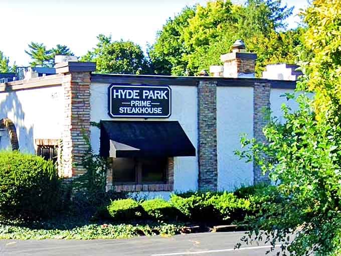 Tucked behind lush greenery, this understated exterior hides the kind of upscale steakhouse experience that keeps regulars coming back.