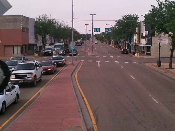 Wide streets and gentle evening light create the perfect setting for a peaceful stroll through downtown tranquility.