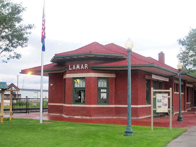 This classic depot building stands proud in brick red, a testament to when train travel connected every town worth visiting.