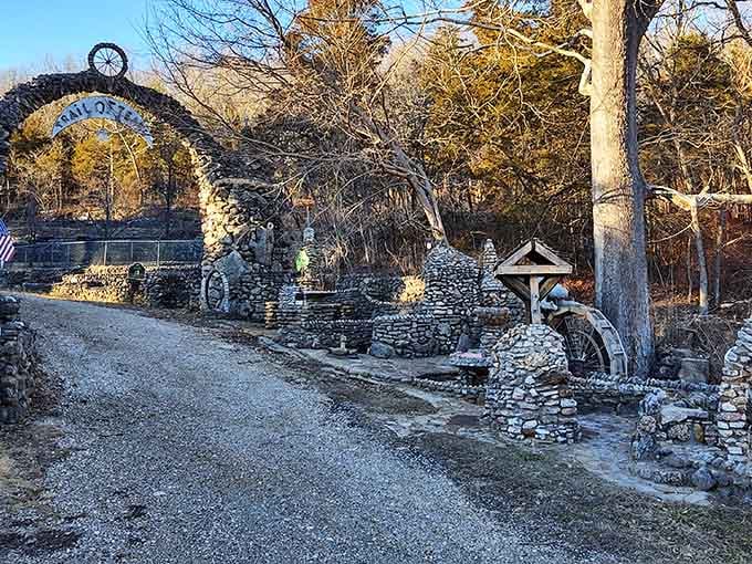Golden afternoon light bathes the memorial's intricate stonework, each carefully placed rock representing hours of thoughtful, meaningful labor.